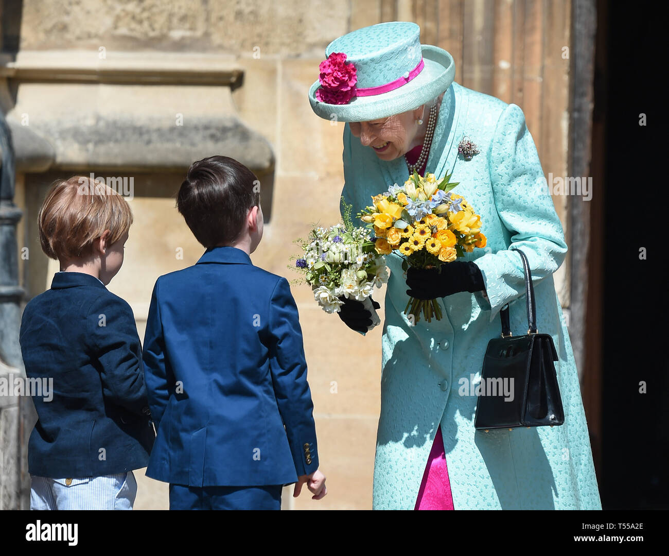 Queen Elizabeth II is presented with flowers as she leaves the Easter ...