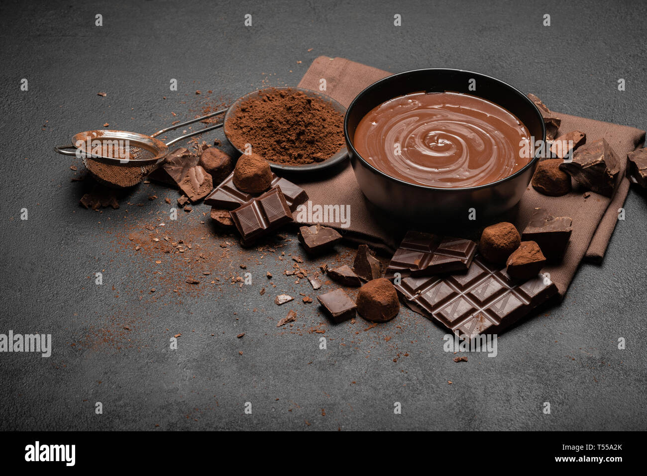 ceramic bowl of chocolate cream or melted chocolate and pieces of ...