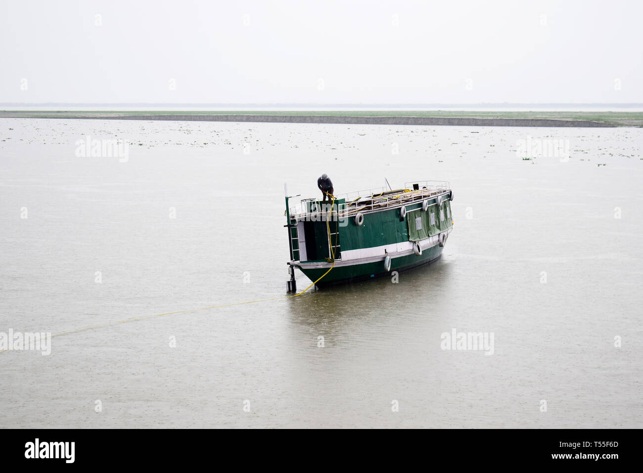 Submerged fishing boat on River Assam in India Stock Photo - Alamy
