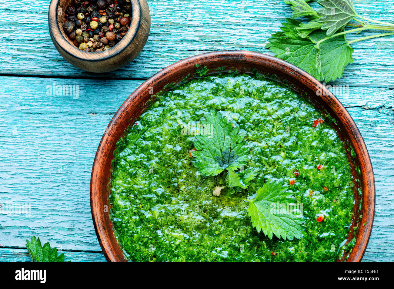 Nettle cream soup on wooden background.Soup with fresh nettles Stock ...