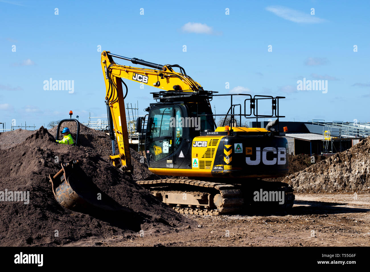 construction site excavators parked on earthworks on building site ...