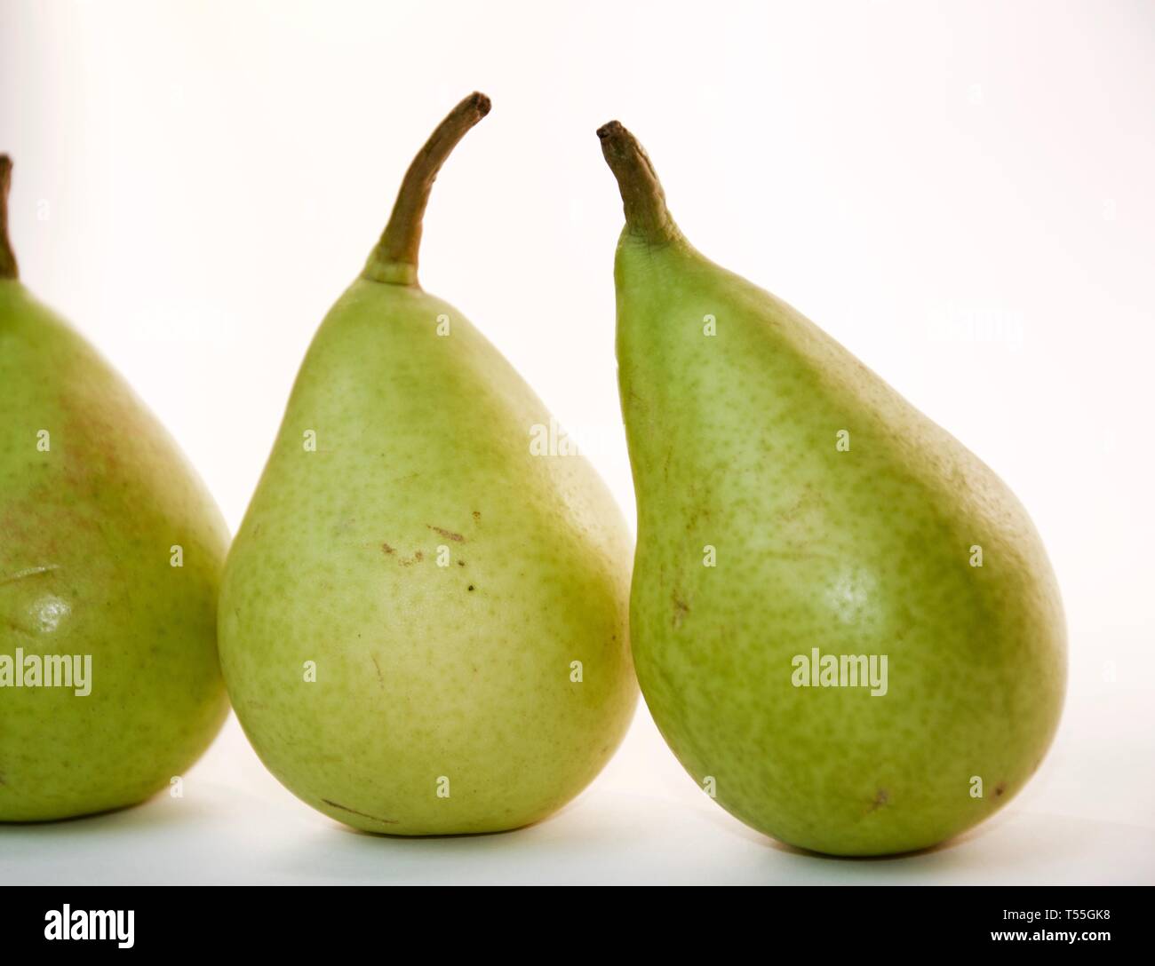 Three pears isolated in white bacground Stock Photo - Alamy