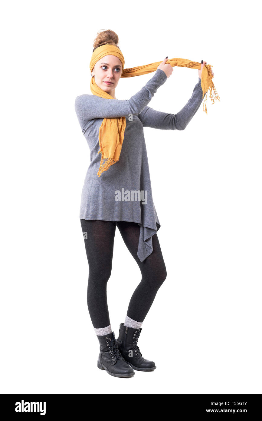 Unique young cute woman getting dressed in authentic clothes making ...