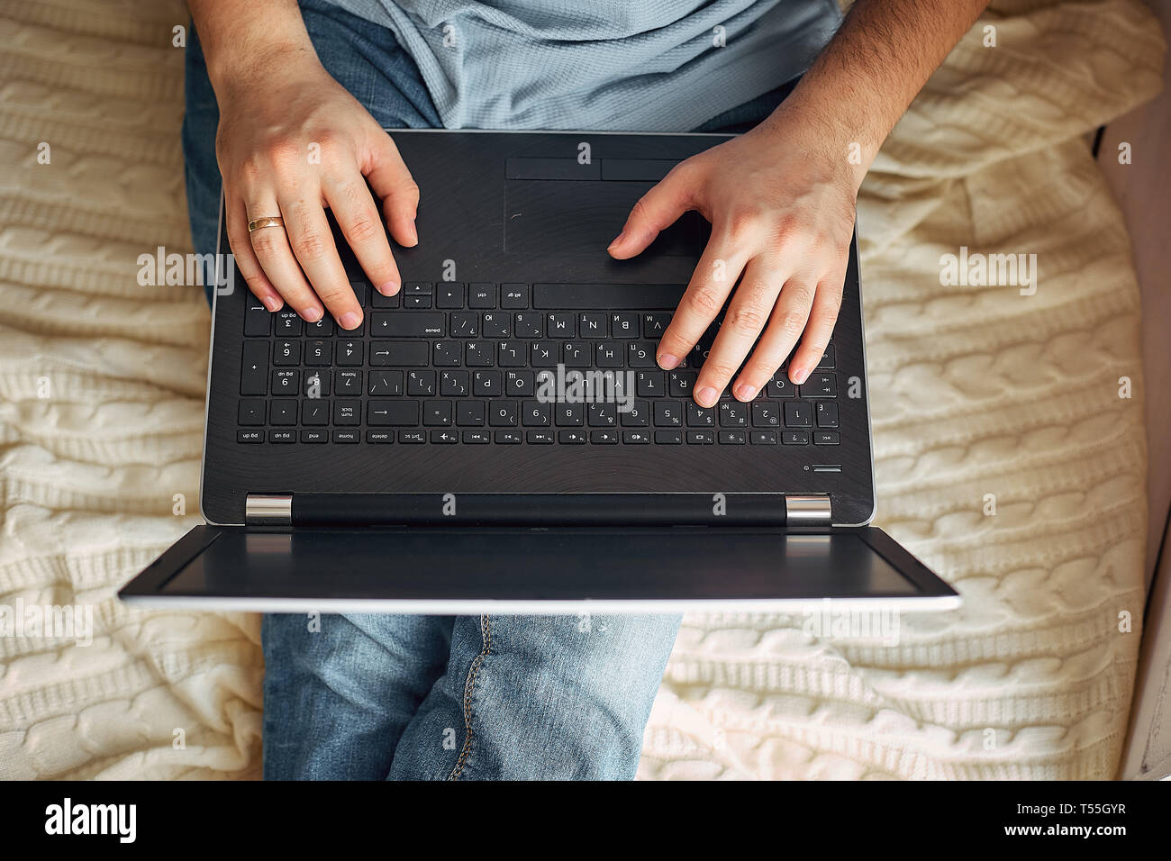Top view of male hands using modern laptop, close up of young man ...