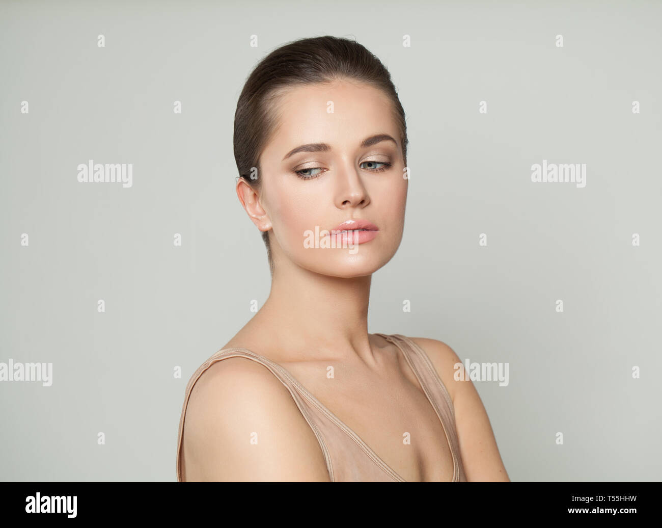 Beautiful female model with clear skin. Skincare and facial treatment ...