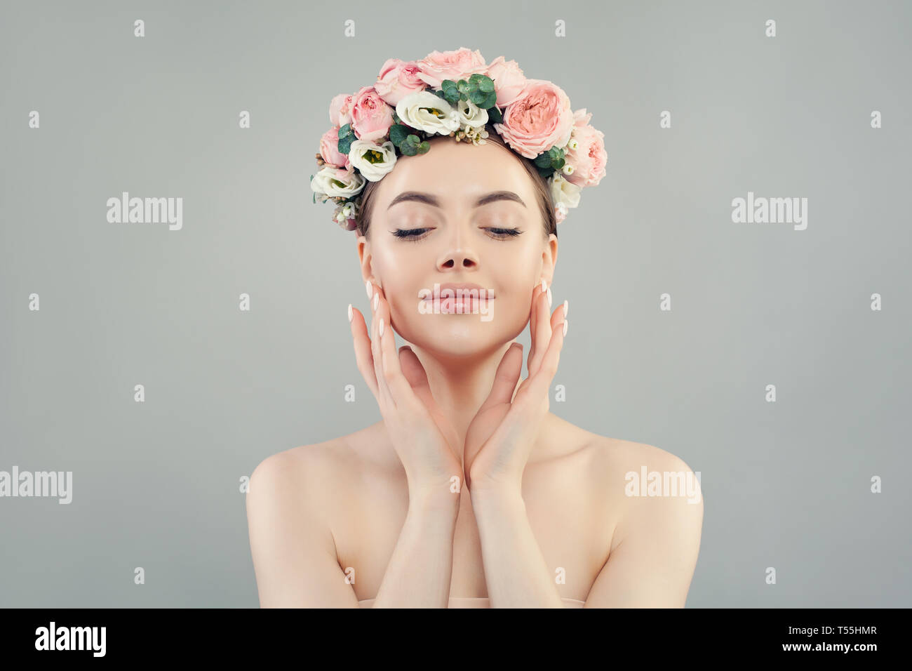 Relaxing Woman With Clear Healthy Skin And Flowers Crown Portrait