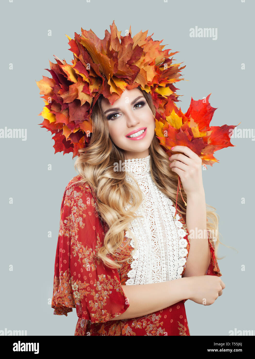 Autumn woman. Beautiful model in autumn leaves crown Stock Photo - Alamy