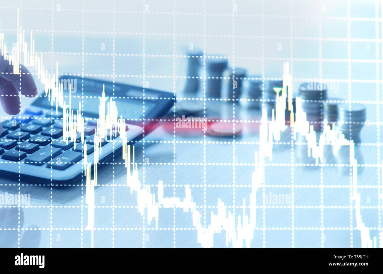 Financial graph chart and rows of coins with calculator Stock Photo - Alamy