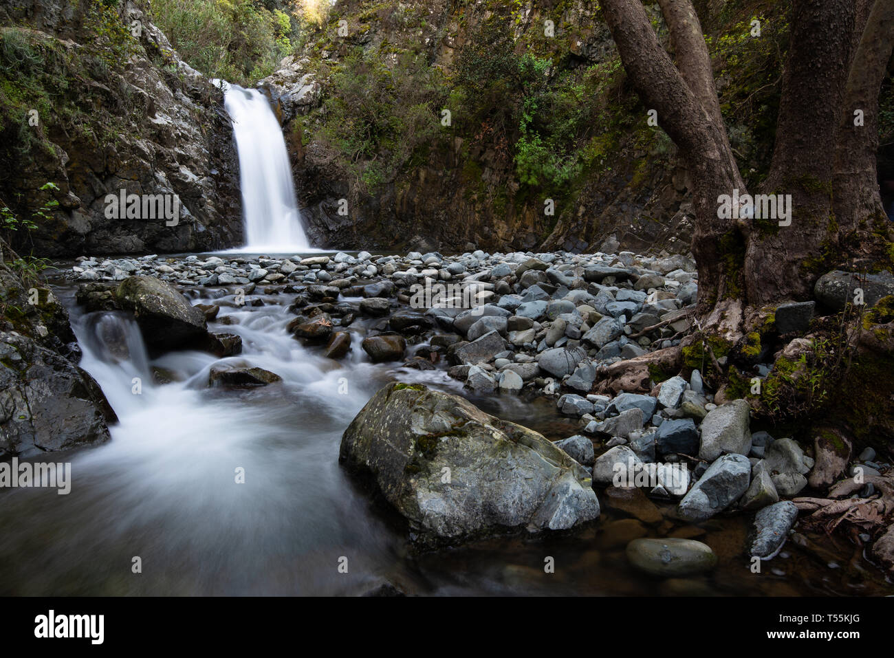 Beautiful Waterfall with stones on the ground in the heart of Machairas ...