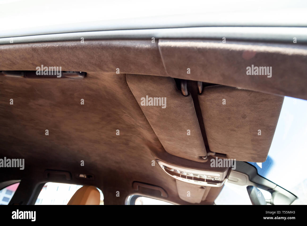 The ceiling of the SUV car pulled by brown soft material alkantara in ...