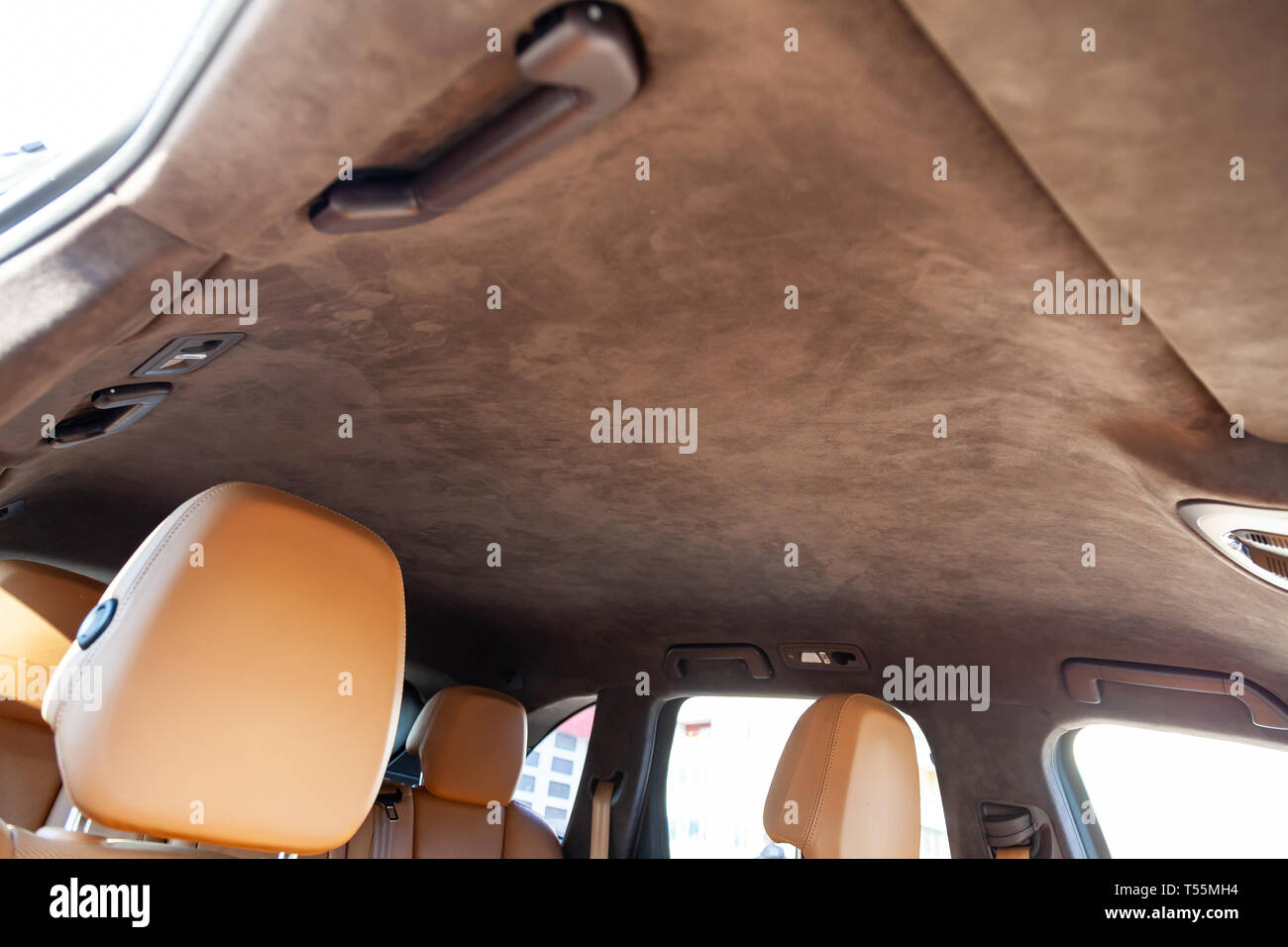 The ceiling of the SUV car pulled by brown soft material alkantara in ...