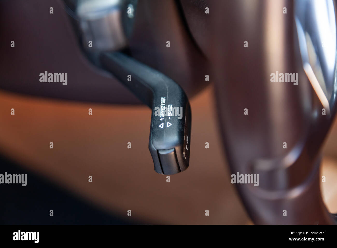 The shift lever to set the automatic cruise control speed inside the ...
