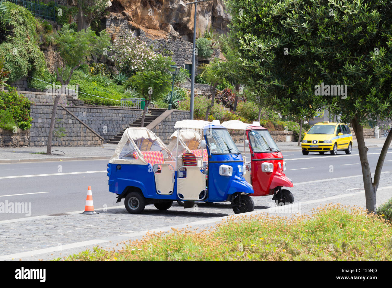 FUNCHAL, MADEIRA, PORTUGAL - JULY 22, 2018: Two tourist electric cars ...