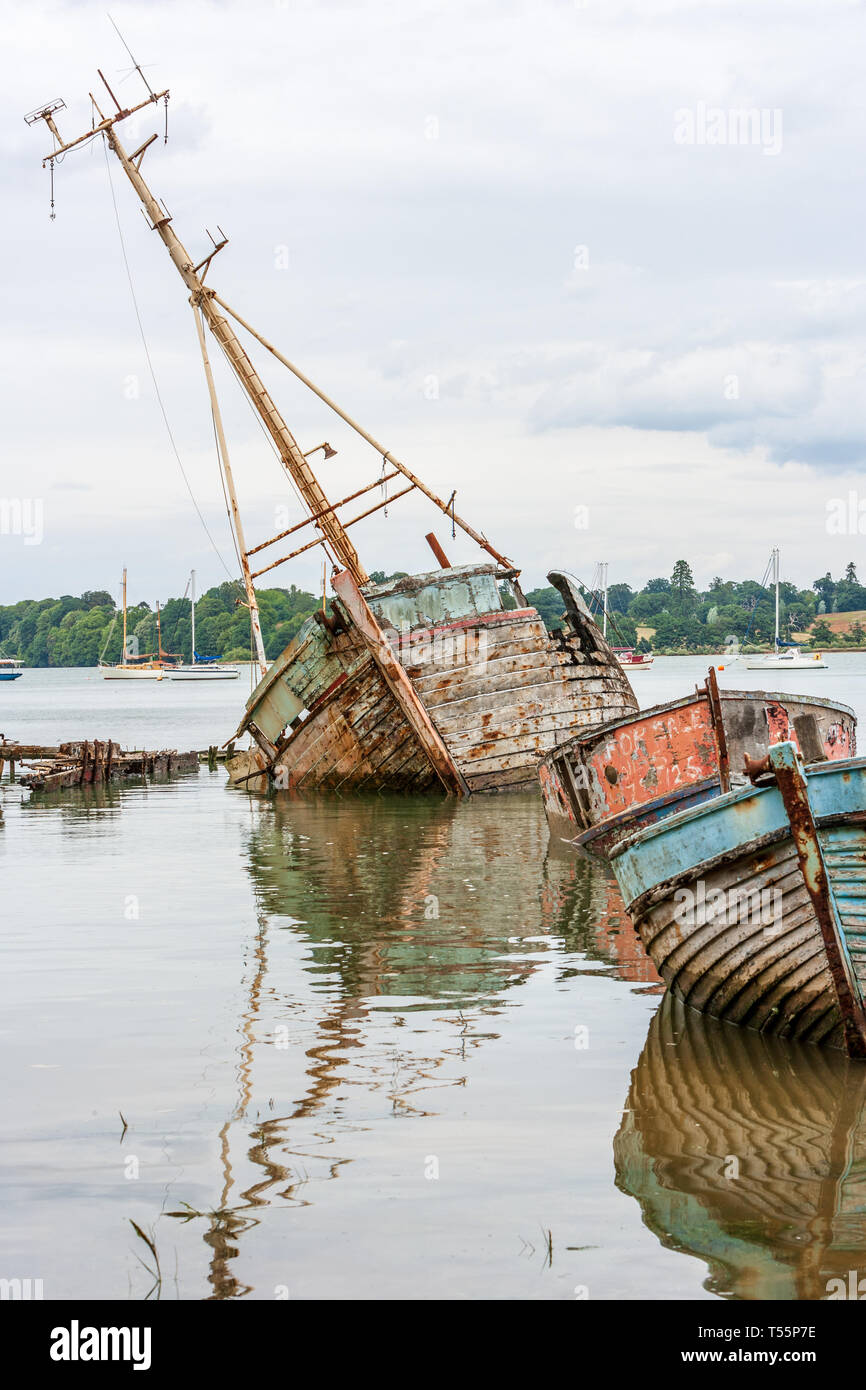 abandoned derelict boats on the river orwell at pin mill in suffolk uk ...