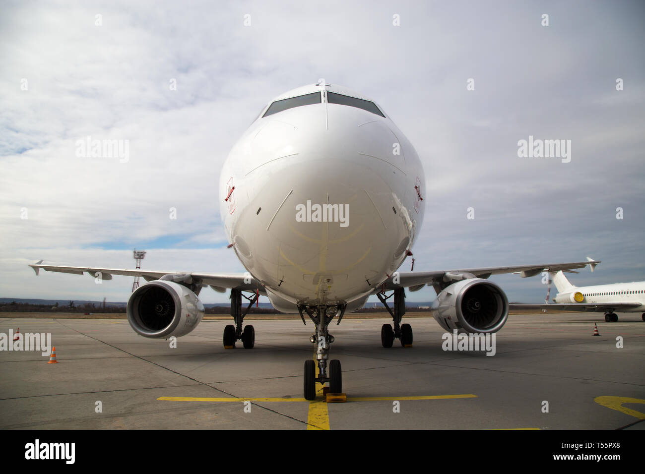 Front, bottom view of civil passenger airplane before departure at the ...