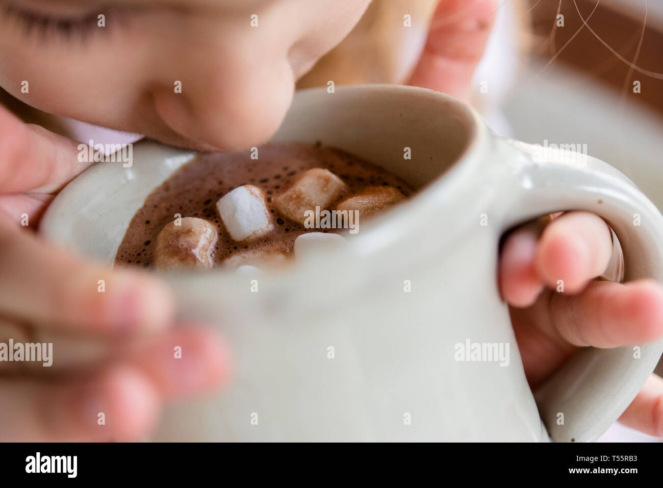 Girl drinking hot chocolate hi-res stock photography and images - Alamy