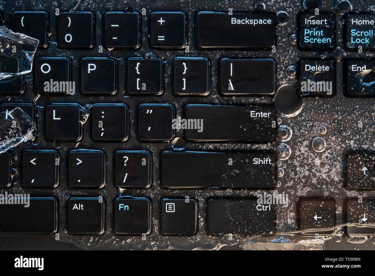 Ice on computer keyboard Stock Photo - Alamy