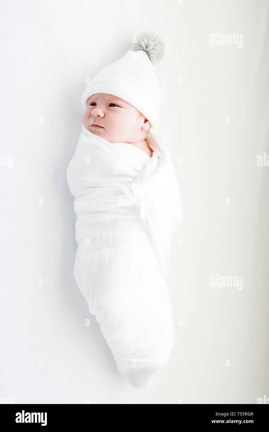 Baby swaddled in a blanket hi-res stock photography and images - Alamy
