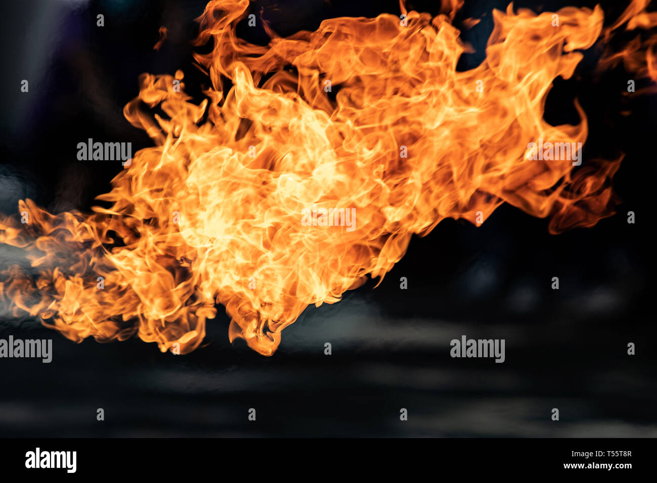 Closeup Fire flames from gas explosion on black background Stock Photo ...