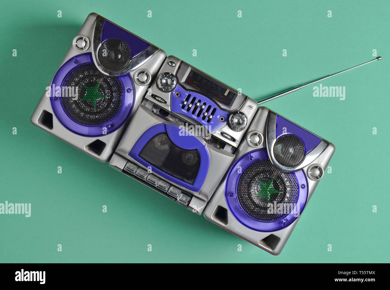 Retro tape recorder on mint-colored pastel background. Technology 80s ...