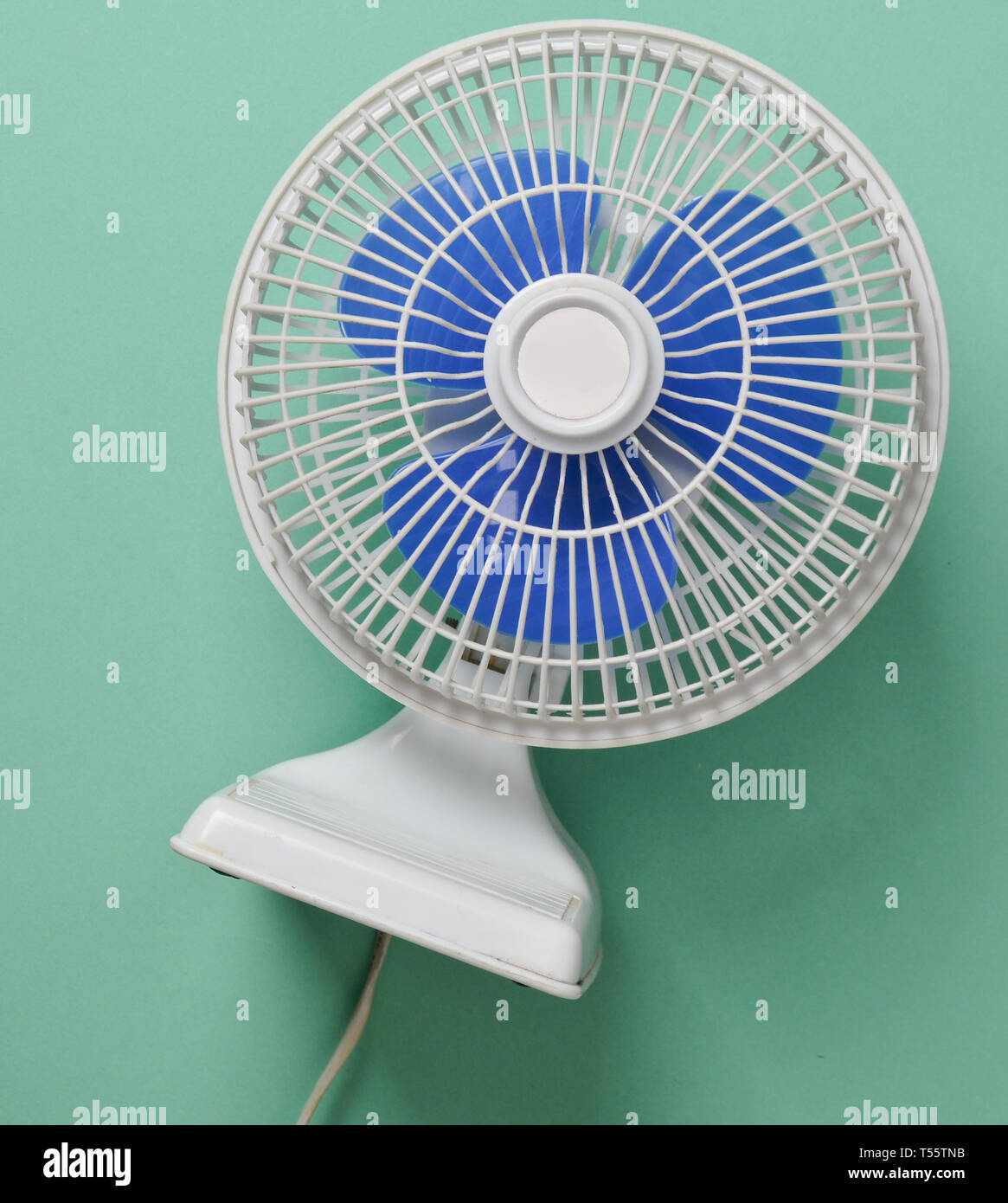 Home mini fan on mint pastel background. Salvation from the heat Stock ...