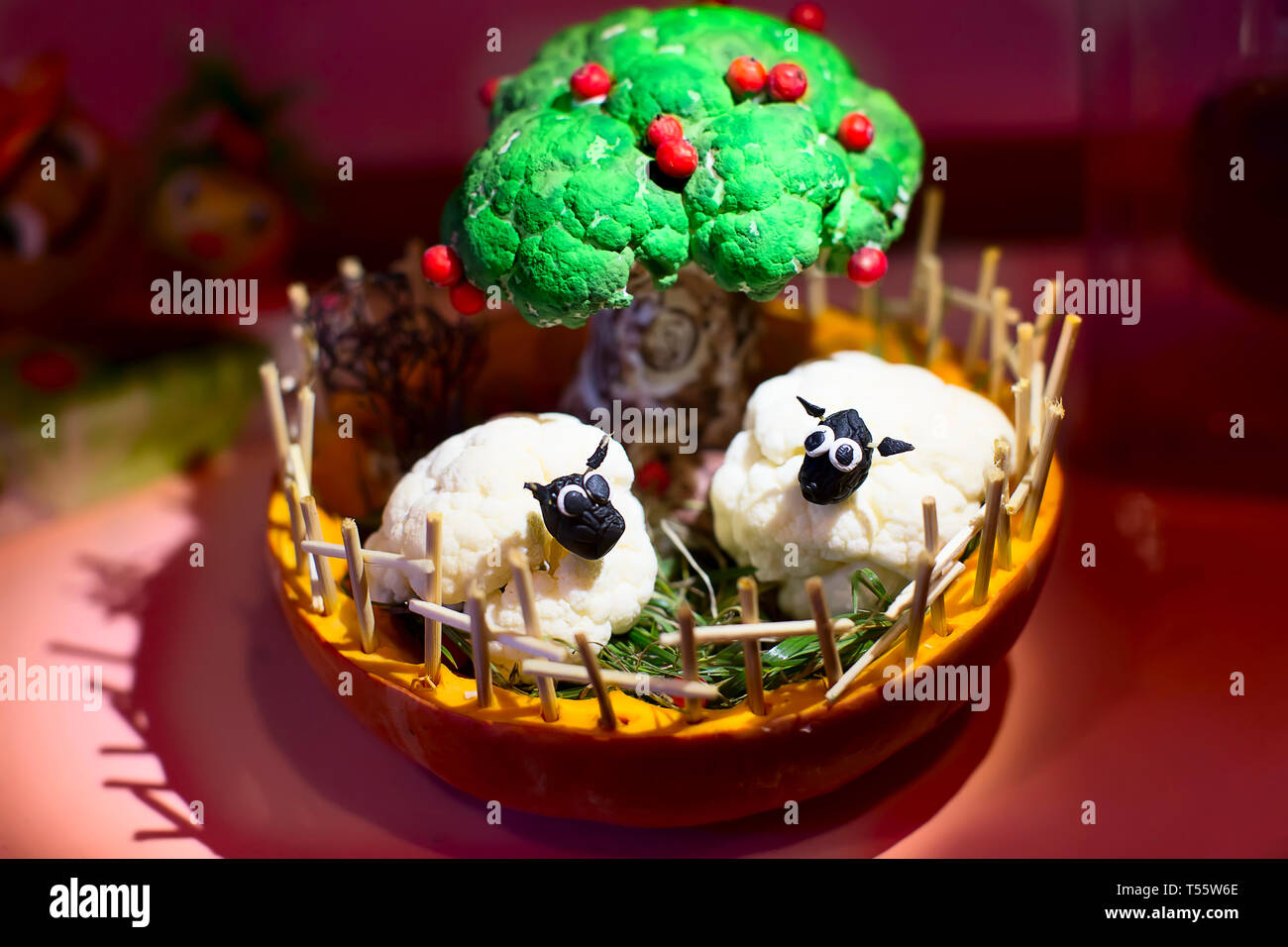 Sheep on the farm and a green tree made from broccoli and cauliflower ...