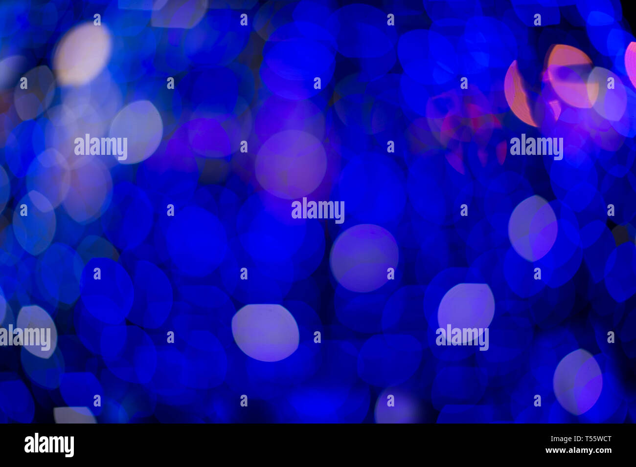 Blue bokeh on a black background Stock Photo - Alamy