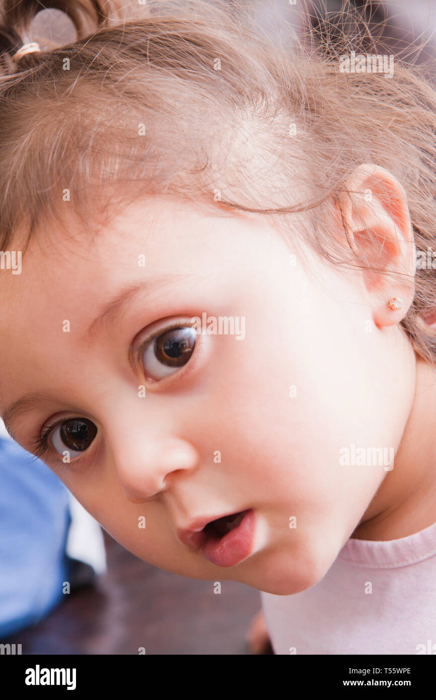 Portrait of curious girl Stock Photo - Alamy