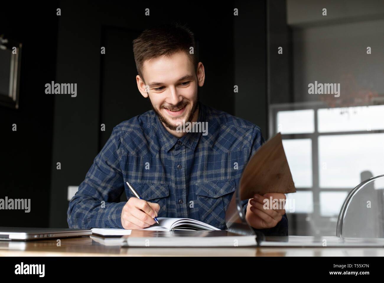Young businessman smiling writing hi-res stock photography and images ...