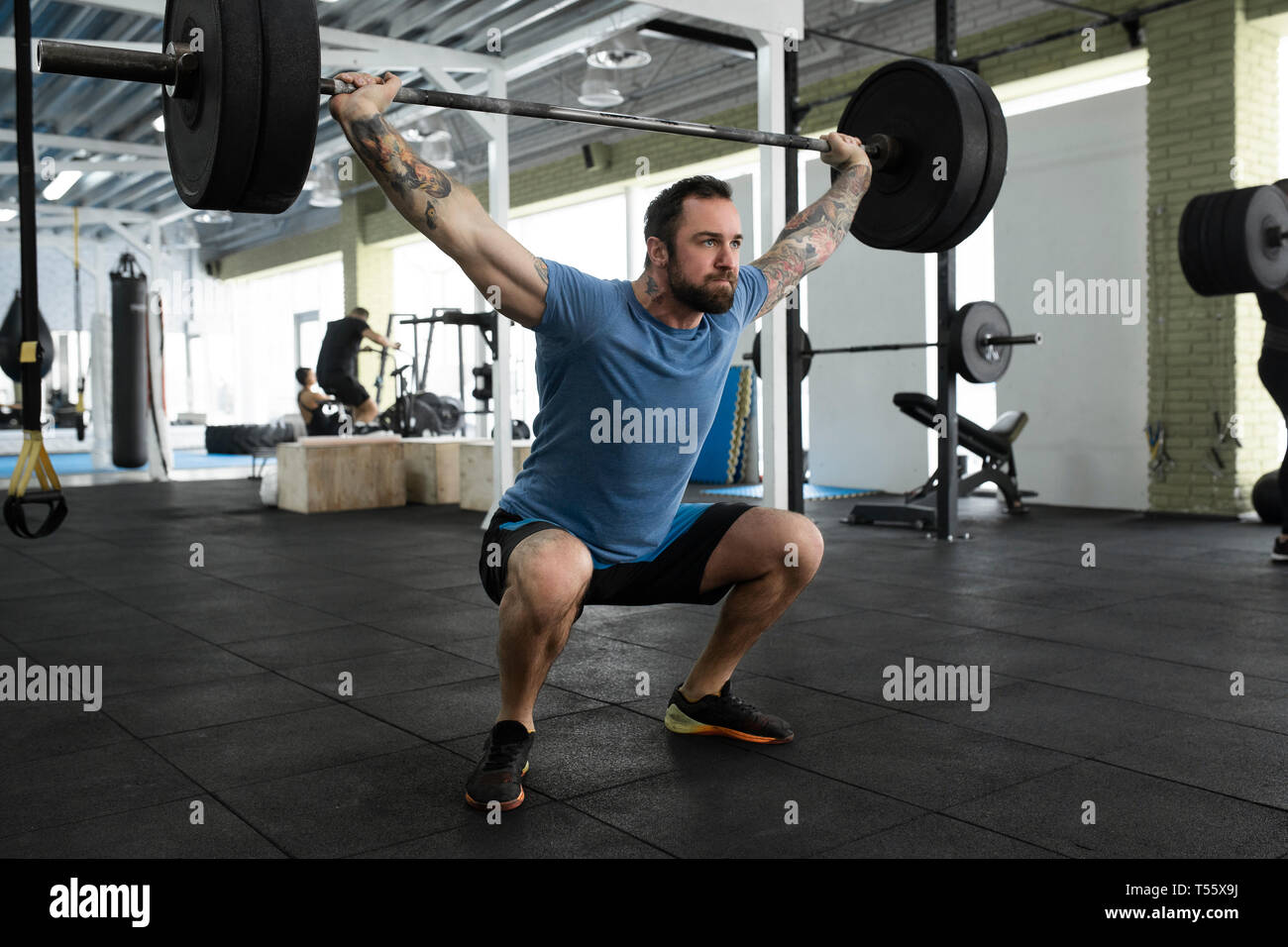 Adult squatting hi-res stock photography and images - Alamy