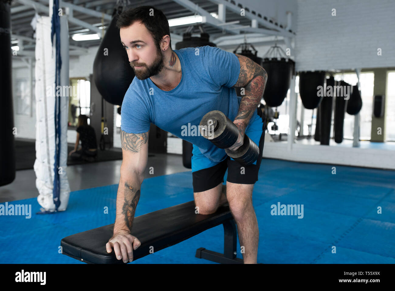 Man lifting dumbbell hi-res stock photography and images - Alamy
