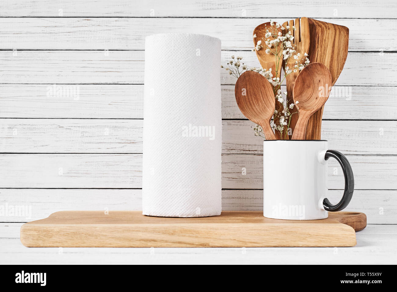 Kitchen tools and cutting board on white table. Kitchen utensils ...