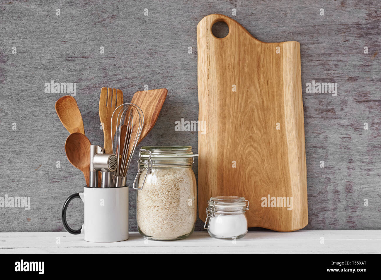Kitchen utensils and cutting board, front view Stock Photo - Alamy