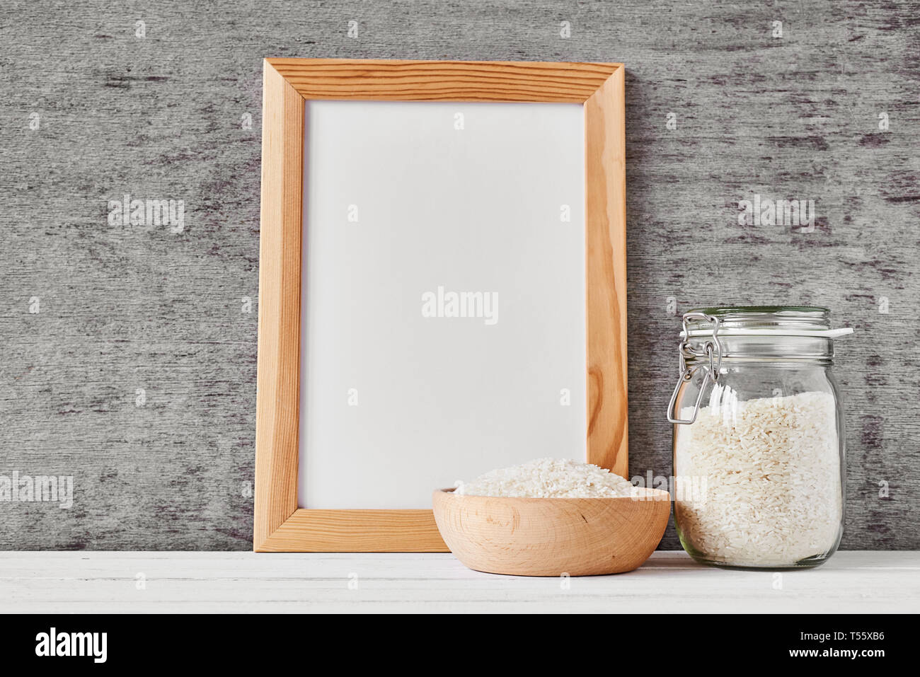 Recipe and menu background. Glass jar with rice and wooden bowl, front ...