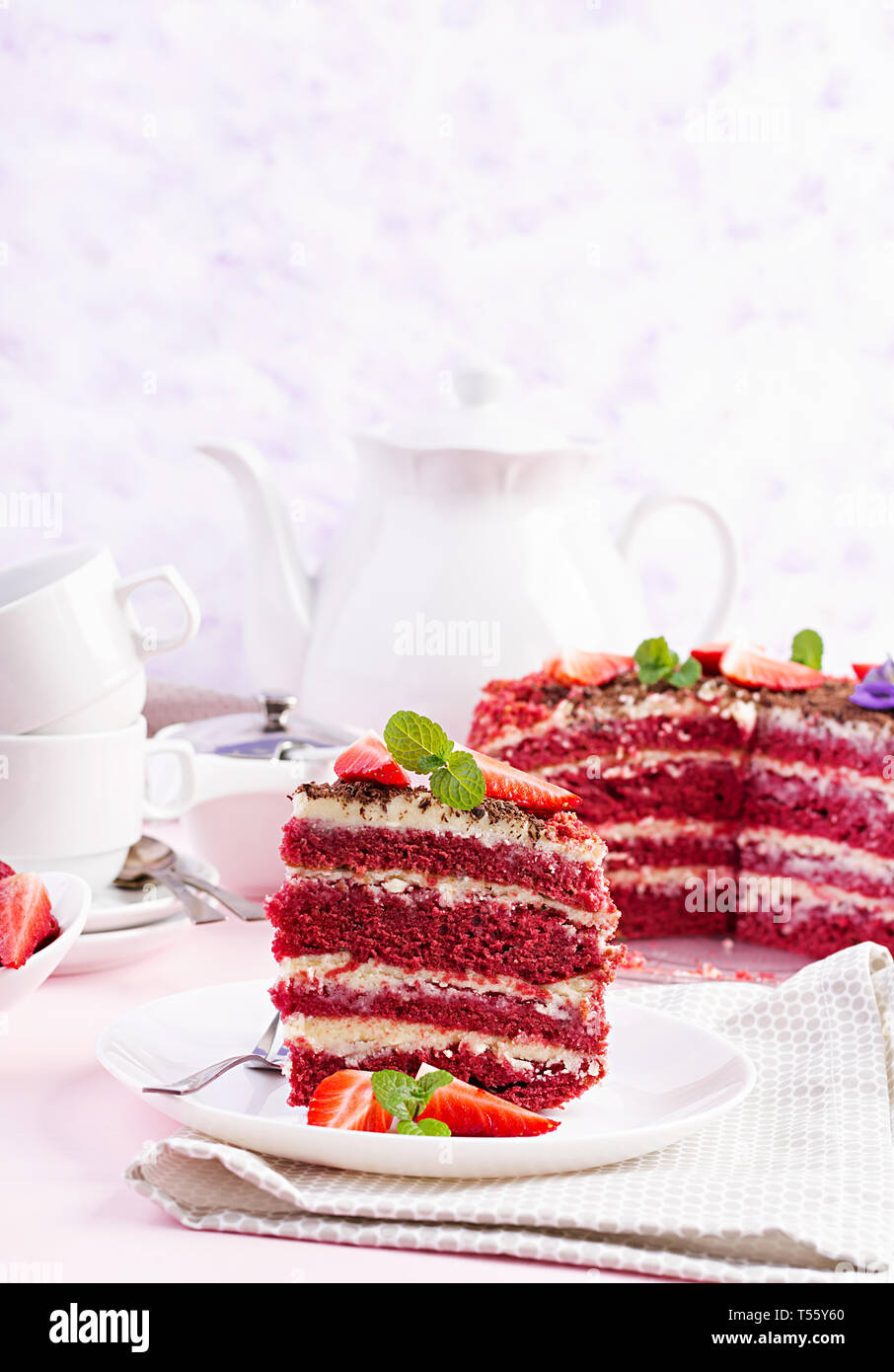 Red velvet cake on a pink background. Tea drinking. Table setting Stock ...