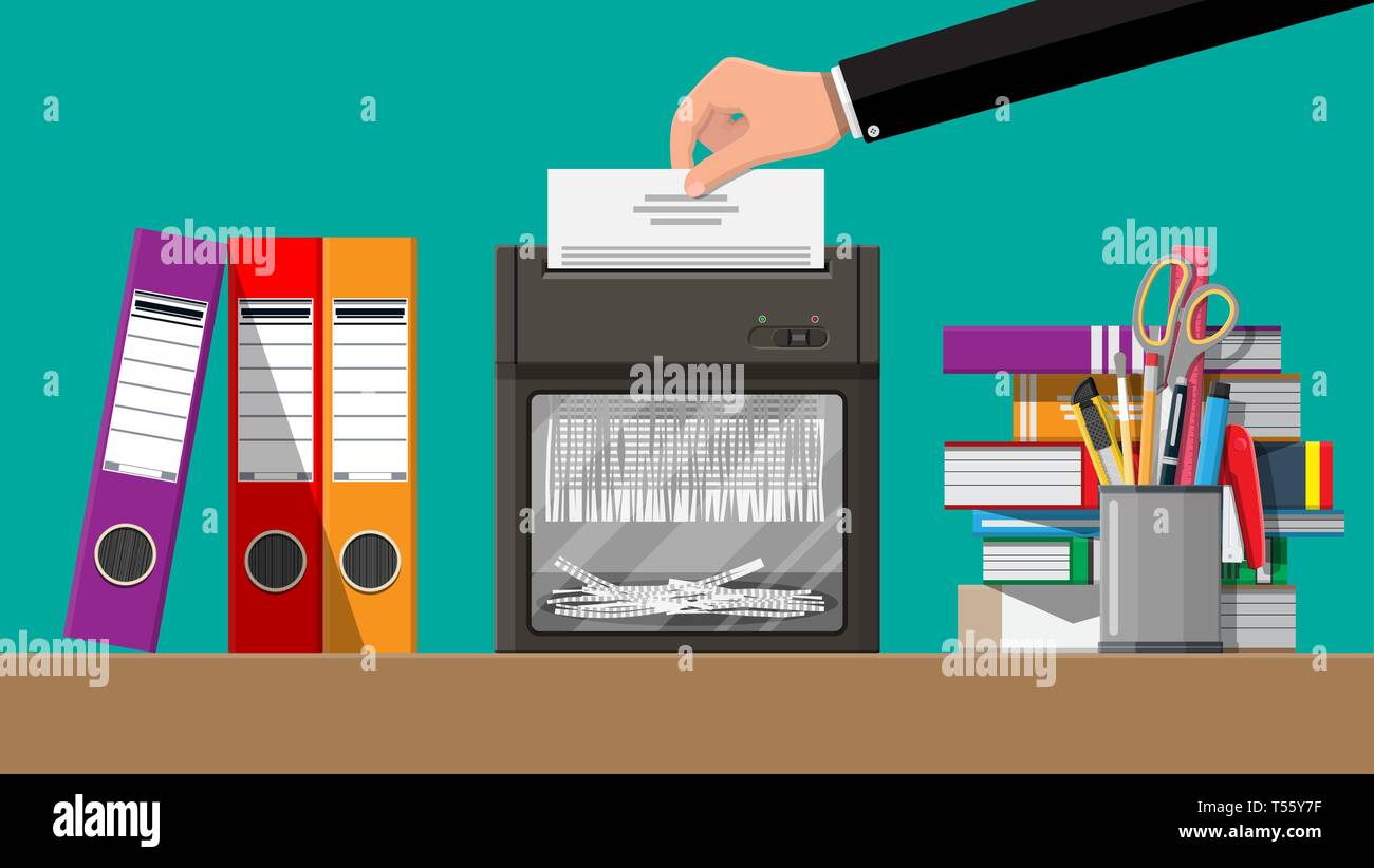 Hand putting document paper in shredder machine. Torn to shreds ...