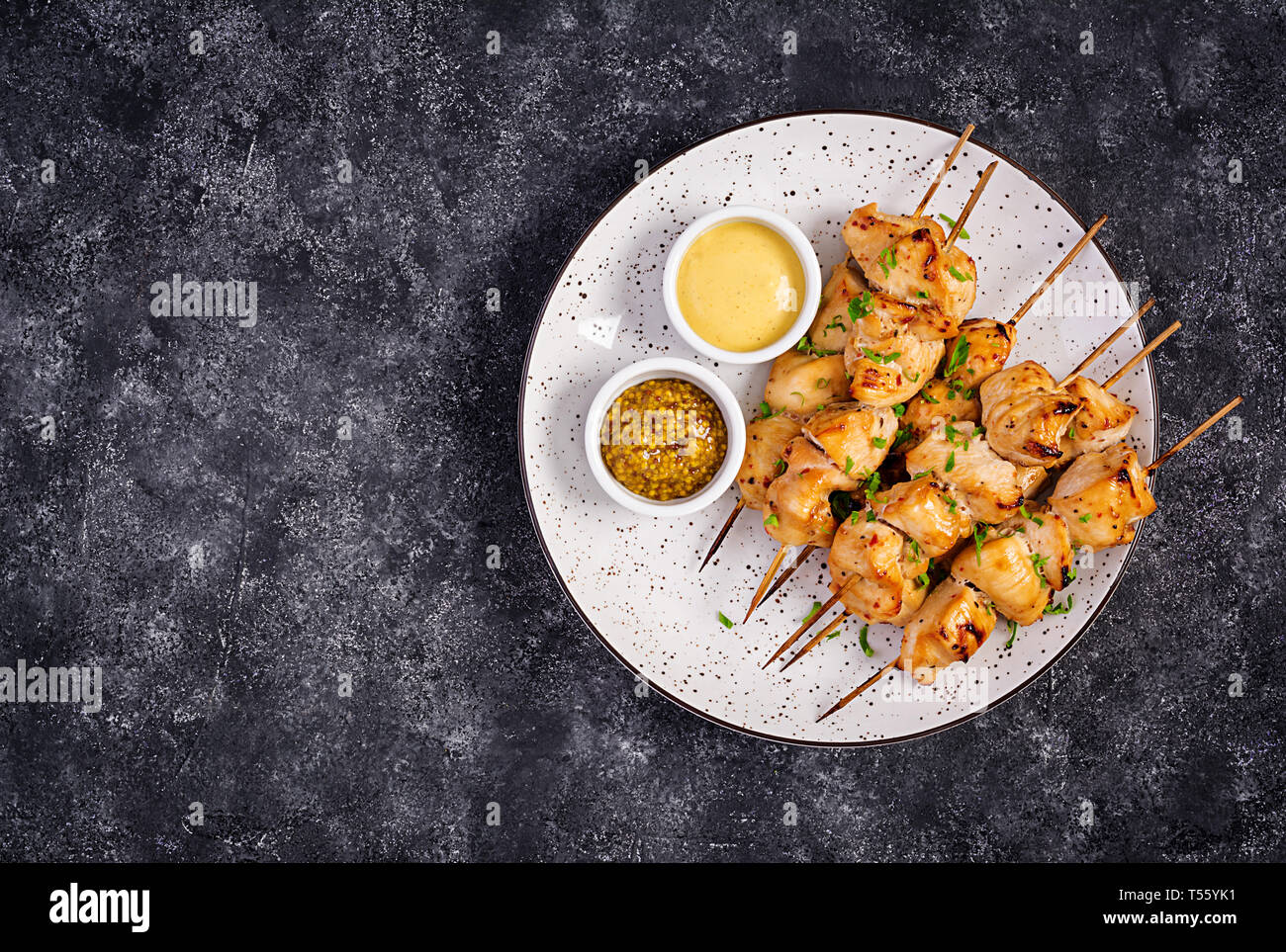 Grilled chicken kebab on a dark background.Copy space. Top view Stock ...