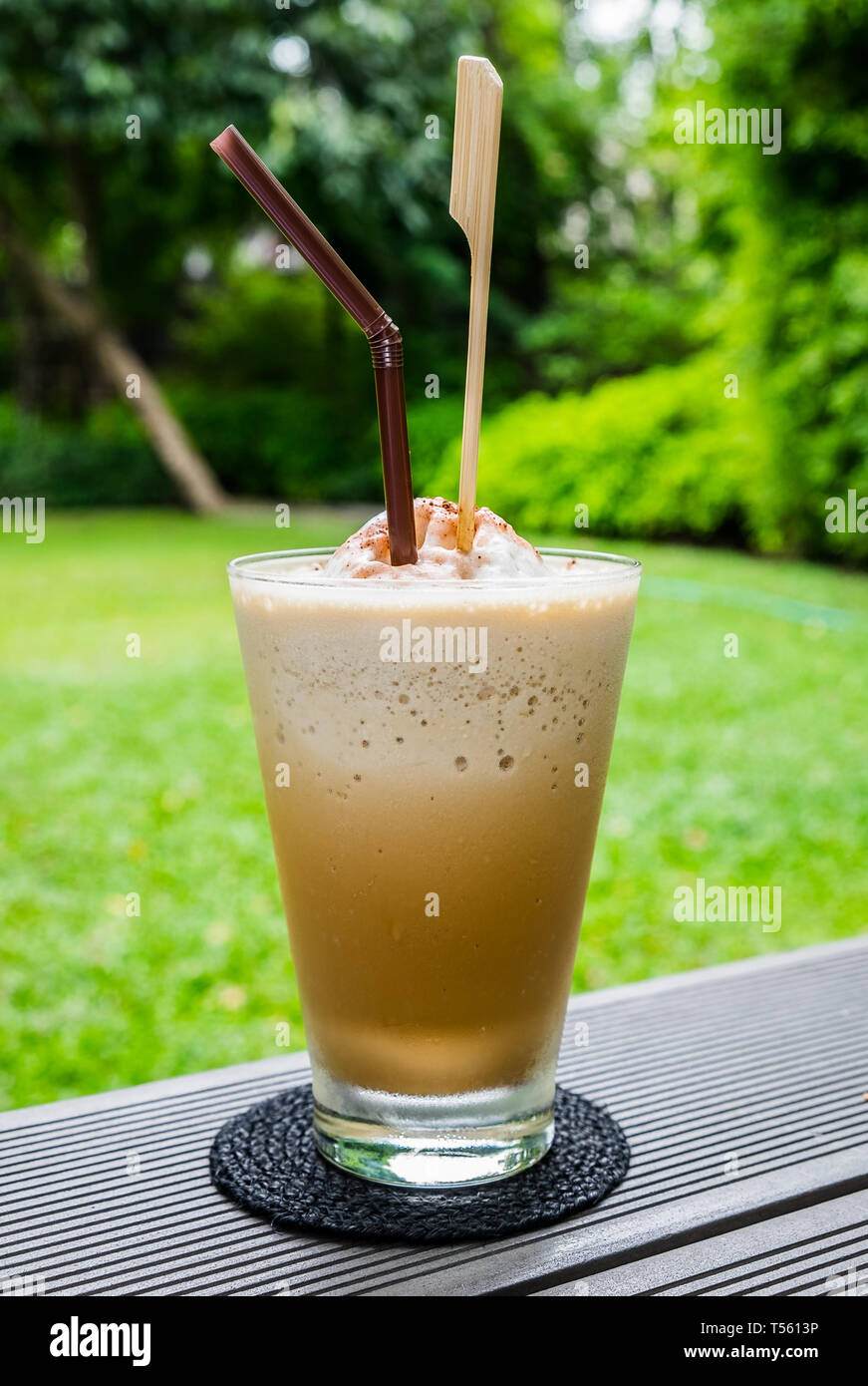 Coffee cappuccino churn froth in glass and straw on table Stock Photo ...