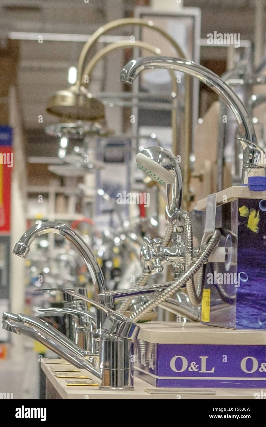 showcase in the store with faucets for the kitchen and bathroom Stock ...