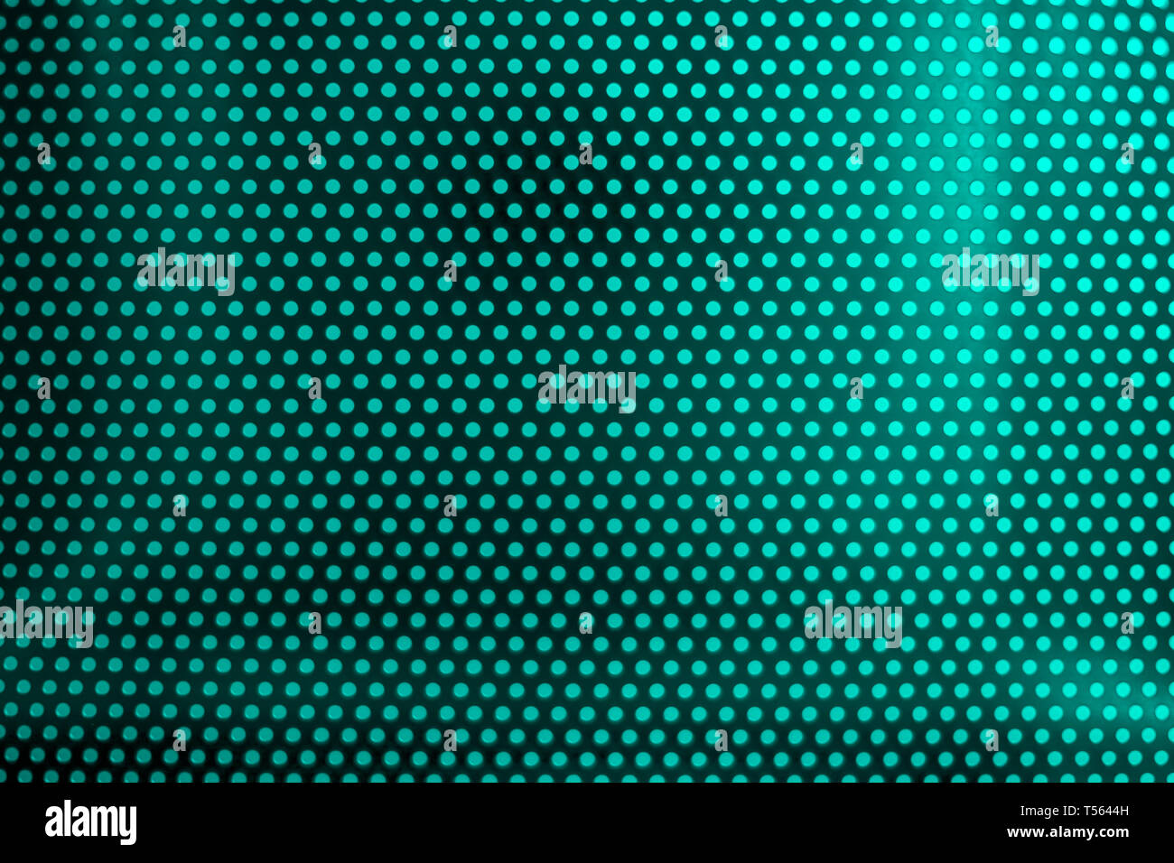 green light through perforated bent metal sheet Stock Photo - Alamy