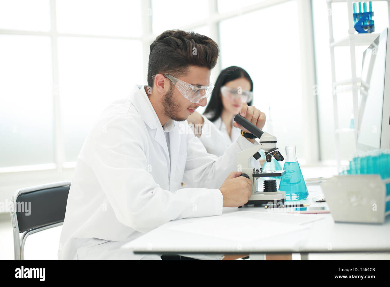 scientists biologists sitting at the laboratory table. science and ...