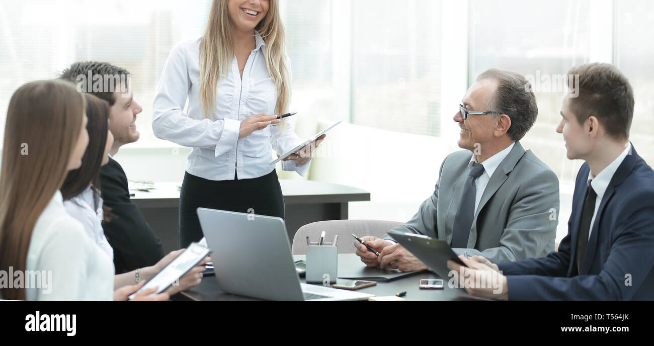 Businesswoman explaining business plan to her colleagues.photo with ...