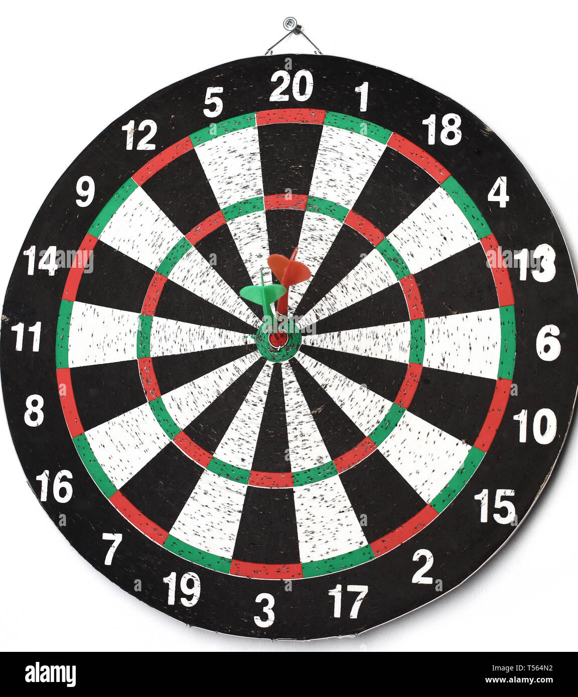 side view.Arrow dart hitting the center of the target dart Board.the ...