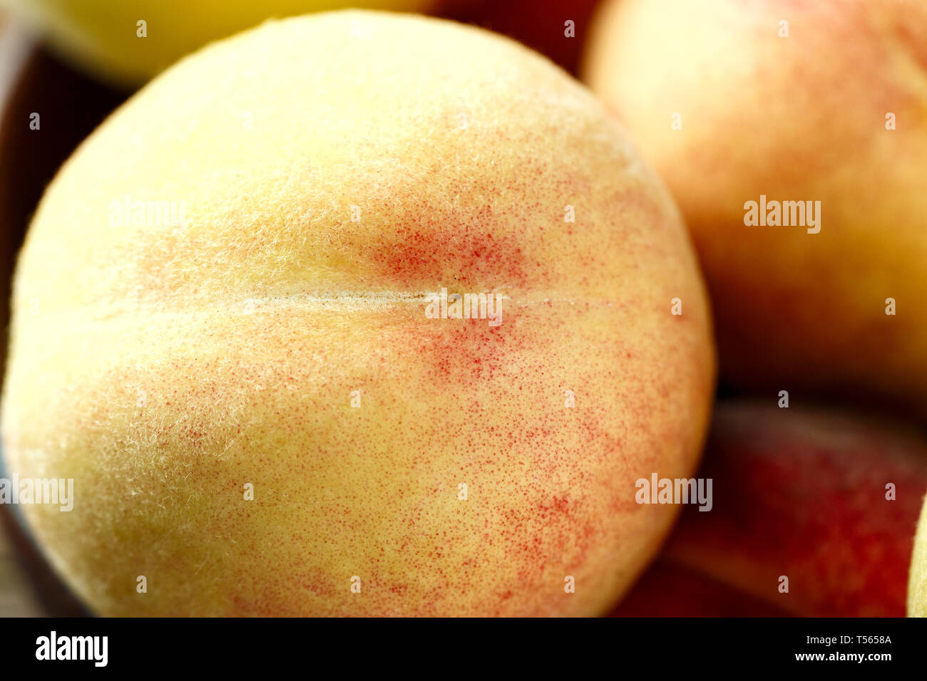 ripe peach close-up. clearly visible texture of the fruit. space for ...