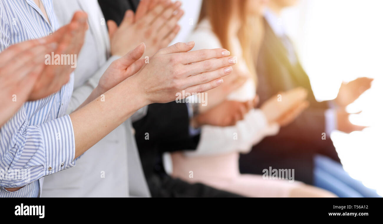 Business people clapping and applause at meeting or conference, close ...