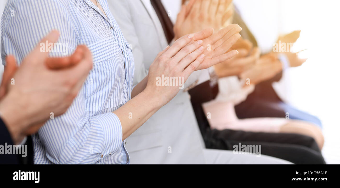 Business people clapping and applause at meeting or conference, close ...