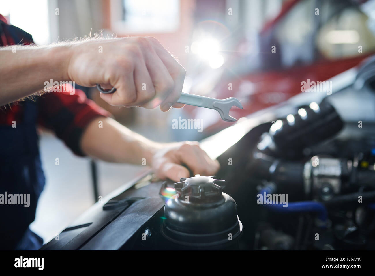 Worker using wrench hi-res stock photography and images - Alamy