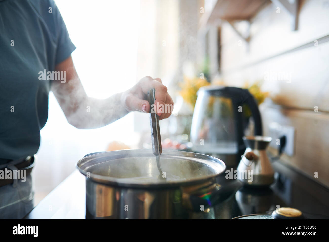 Cooking in pan Stock Photo - Alamy