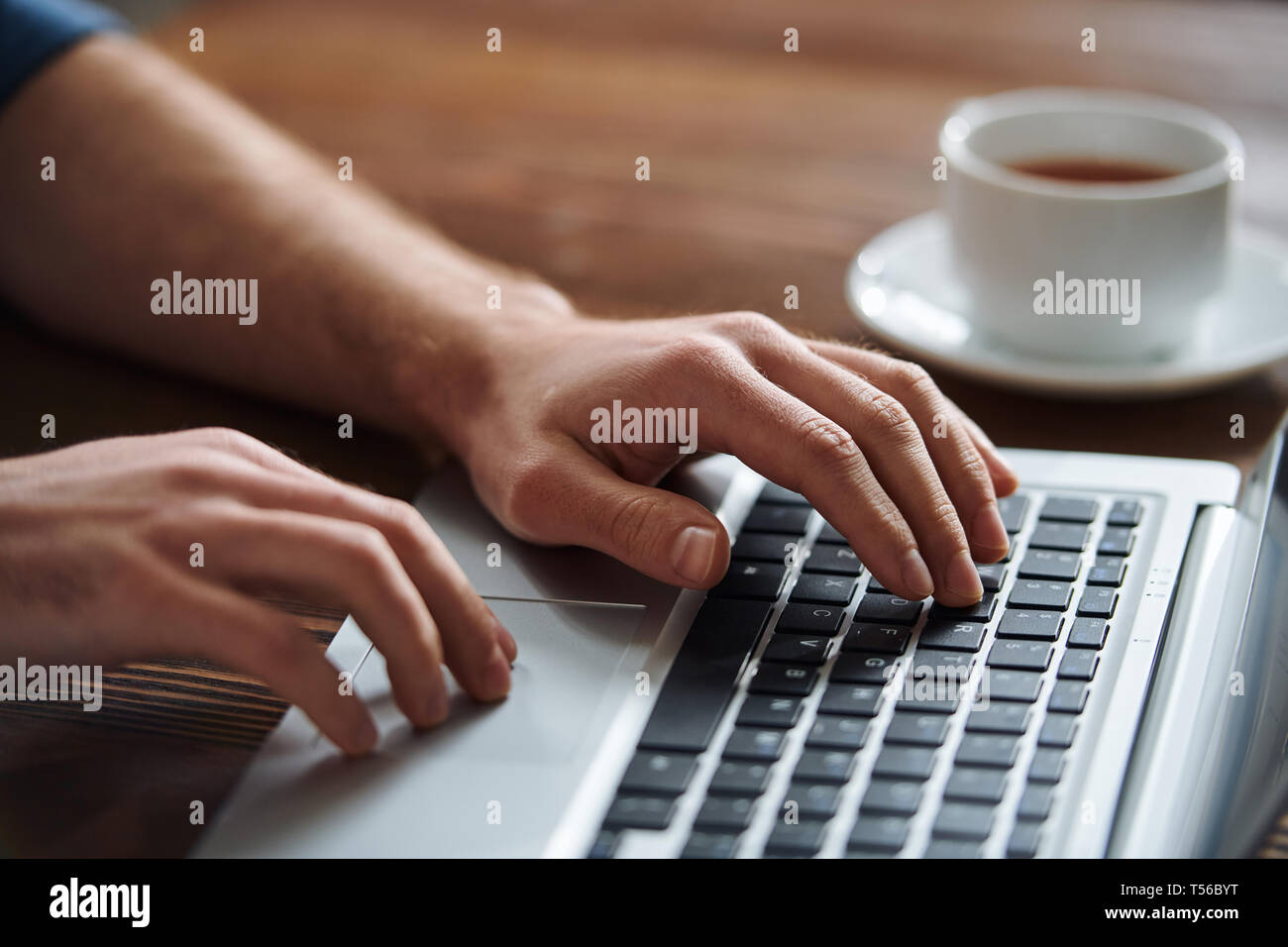 Typing by workplace Stock Photo - Alamy