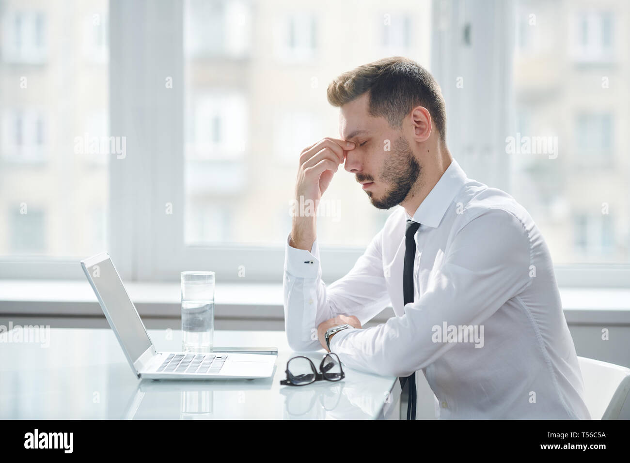 Headache tense young man working hi-res stock photography and images ...